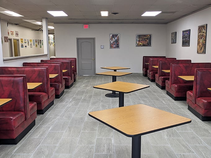 The dining room waits patiently between rushes, like a theater between performances—red booths standing ready for the next breakfast drama to unfold.