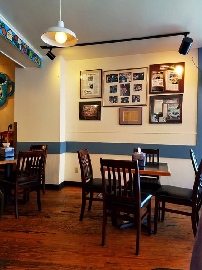 Cream walls adorned with framed memories – because great delis understand they're not just feeding stomachs, but souls.