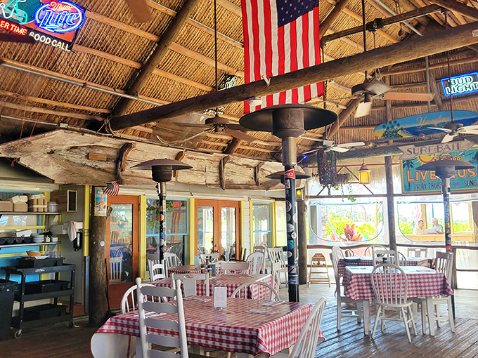 American flags and thatched roofs create the perfect "somewhere in the Florida Keys" atmosphere, even though you're actually on the Treasure Coast.