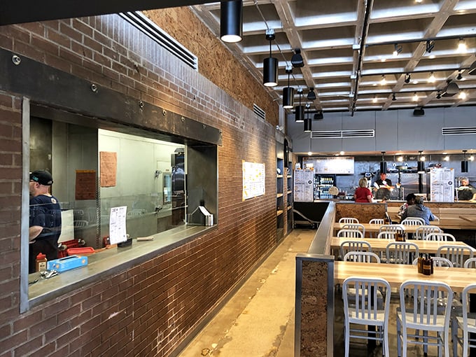 The open kitchen layout – barbecue theater at its finest. Watch the choreographed dance of slicing, weighing, and serving with mesmerizing precision.