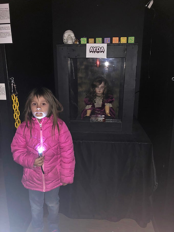 Young explorers brave the darkness to meet Ayda face-to-face. That flashlight isn't just for seeing—it's emotional support equipment.