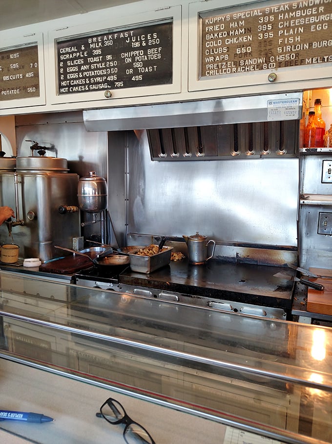 The kitchen at Kuppy's isn't designed for show—it's a battlefield where breakfast has been winning the war against hunger for decades.