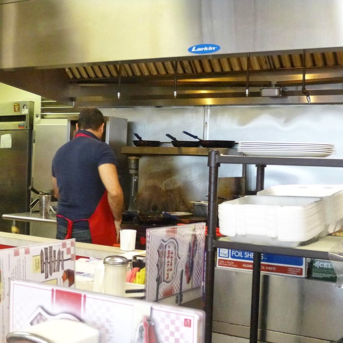 Where the magic happens – a glimpse into the kitchen reveals the choreographed dance that transforms simple ingredients into memorable meals.