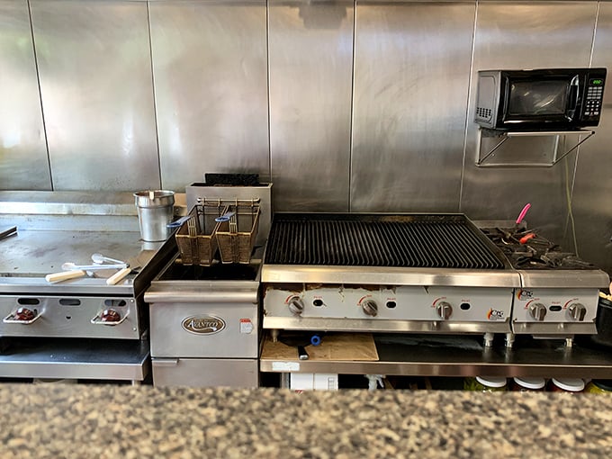 The battlefield where cheesesteak magic happens. That well-seasoned grill has seen more action than a Rocky training montage.