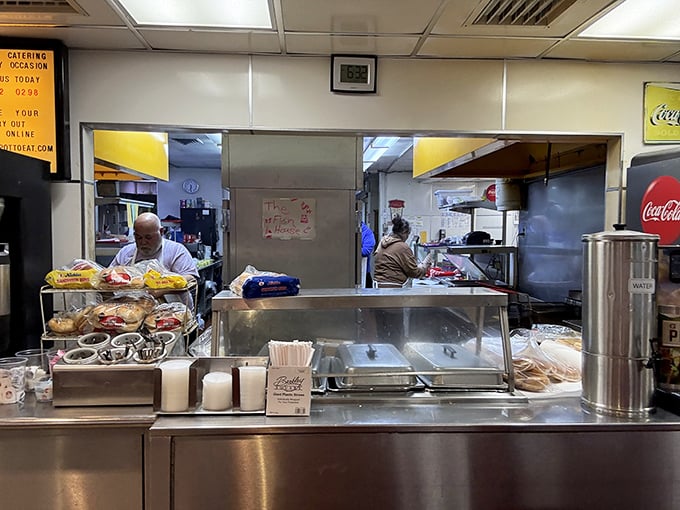 The kitchen pass—where culinary magic happens with choreographed precision that would impress Broadway directors.