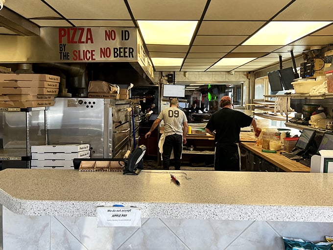 Behind the scenes where pizza magic happens—no wizards, just dedicated folks who understand the science of deliciousness. 
