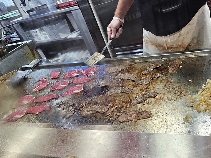 The flat-top grill—where thinly sliced beef transforms from mere protein to the stuff of Philadelphia legend.