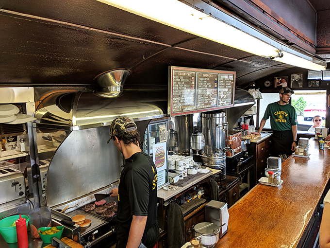 The kitchen choreography is mesmerizing—staff navigating the narrow space with the precision of submarine operators during a deep dive.