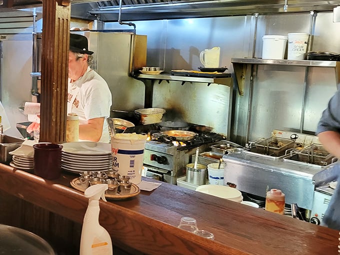 A glimpse into the kitchen reveals the organized chaos where seafood magic happens—no smoke and mirrors, just skill and dedication.