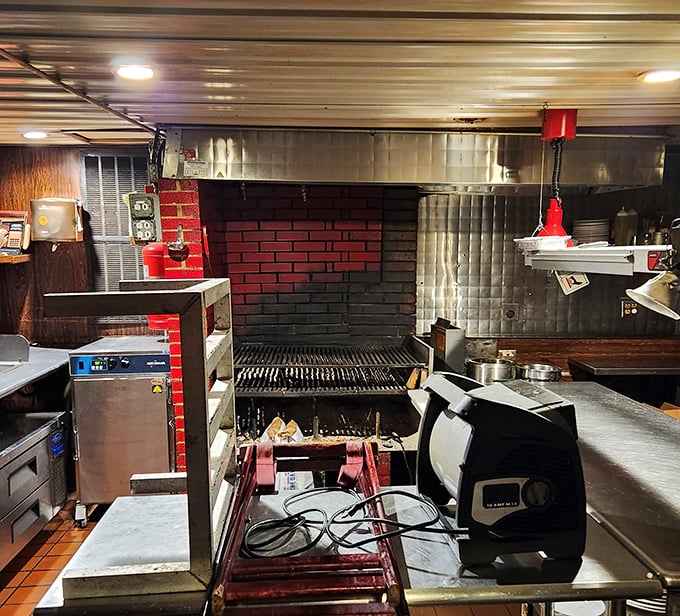 Where the magic happens—this kitchen's open flame grill isn't just cooking equipment, it's a time machine to when food was honest and straightforward.