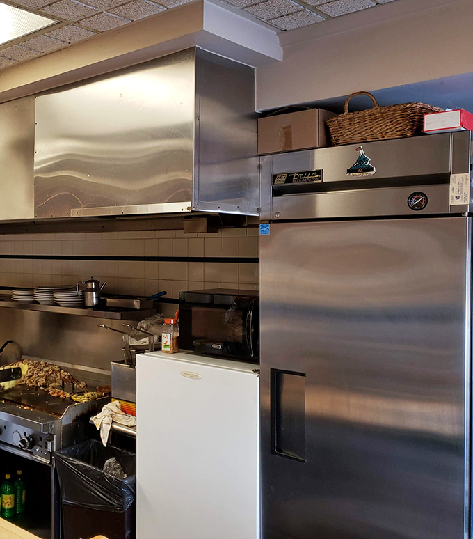 The kitchen – where breakfast magic happens with no smoke, mirrors, or pretension – just decades of short-order wisdom and a well-seasoned grill.