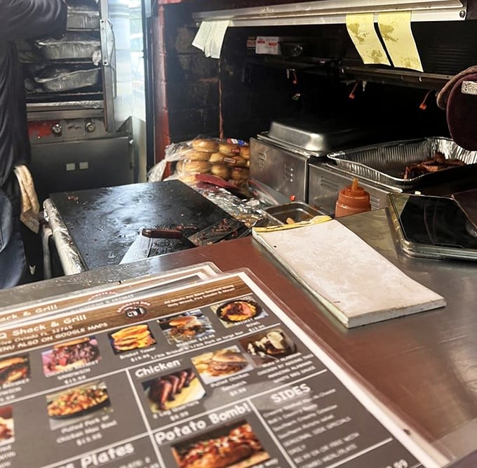 The kitchen view reveals the battlefield where smoke meets meat. This is where the alchemy of barbecue transforms the ordinary into the extraordinary.