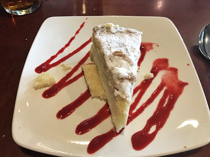 A slice of lemon cream cake that somehow manages to be both cloud-light and deeply satisfying—the sweet finale your meal deserves.