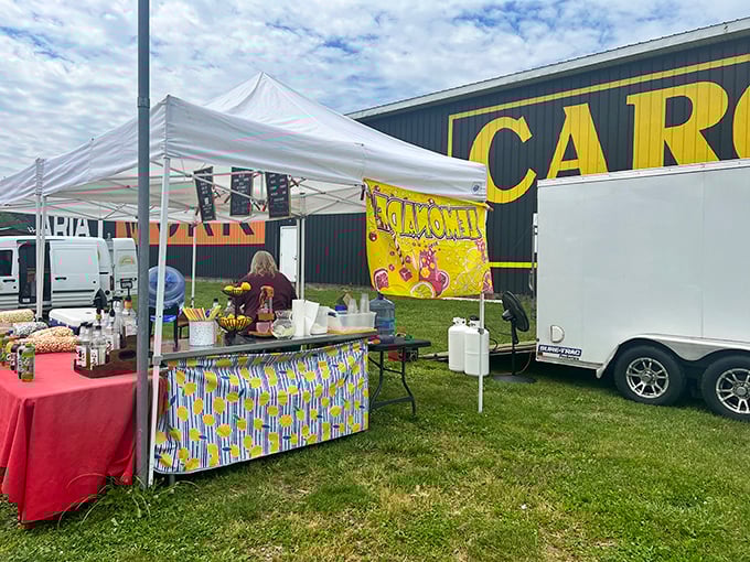 The lemonade stand beckons with its bright yellow sign, promising sweet relief from treasure-hunting thirst.