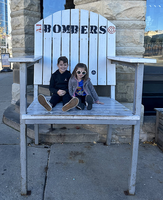 The oversized Adirondack chair outside isn't just seating—it's a photo op that says, "Yes, we came, we saw, we conquered the Milwaukee Burger."