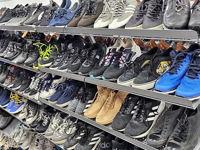 Men's shoes lined up like soldiers ready for duty—some barely worn, as if their previous owners discovered comfort matters more than style.