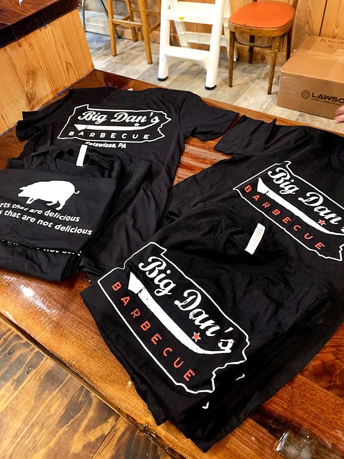 True BBQ devotees don't just eat the food—they wear the merch with pride, like members of a delicious, sauce-stained secret society.