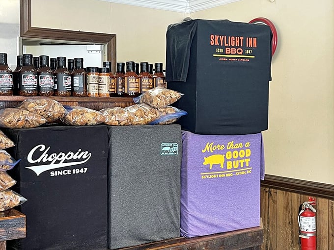 The merchandise wall tells you everything: "Choppin' Since 1947" isn't just a slogan—it's a way of life in Ayden.