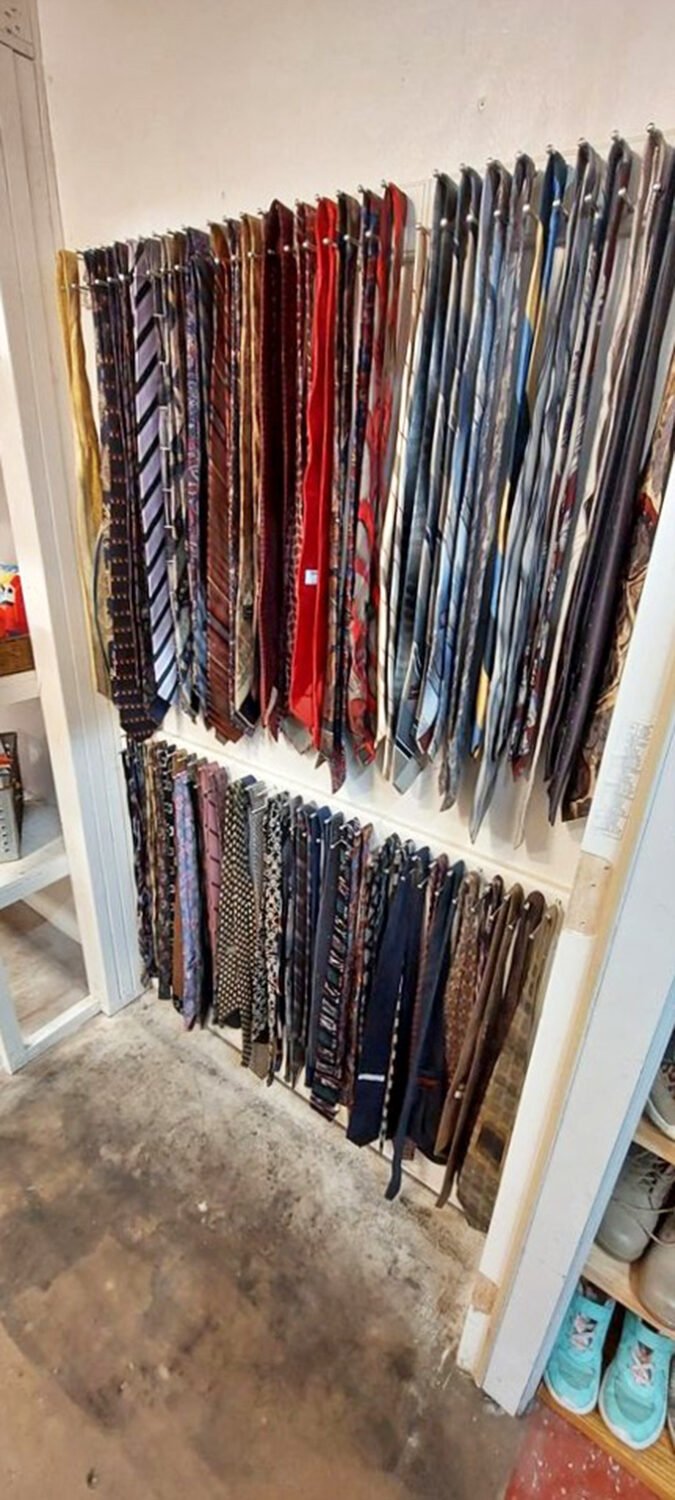 The necktie collection showcases corporate America's discarded fashion statements, ready for their professional comeback tour together.