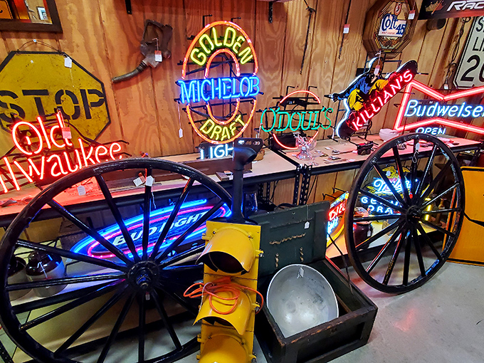 Neon beer signs cast their electric glow across wagon wheels and traffic lights—the perfect man-cave décor for those who prefer their nostalgia illuminated.