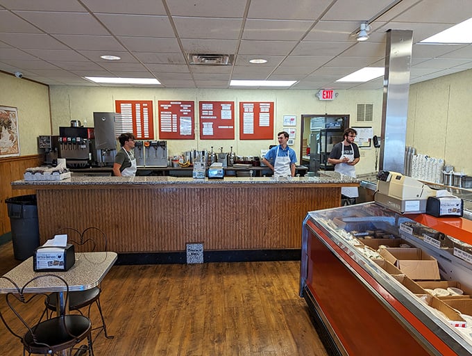 The counter where memories are made, one scoop at a time. These servers aren't just employees—they're happiness engineers in aprons. 