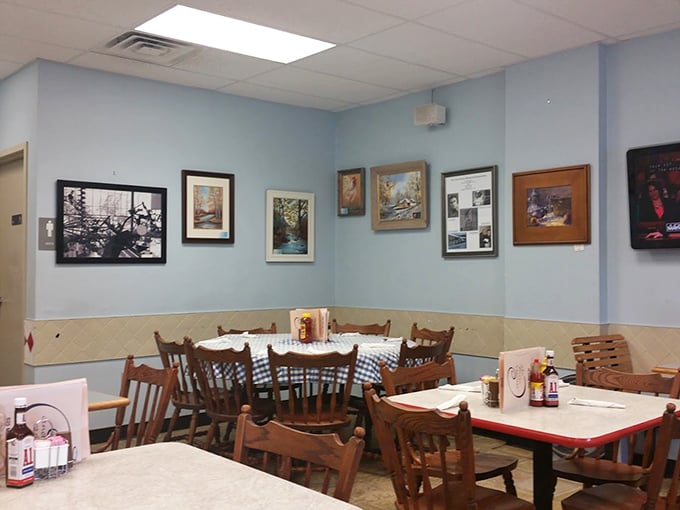 Blue walls adorned with local artwork create the perfect backdrop for conversations that linger longer than the coffee.
