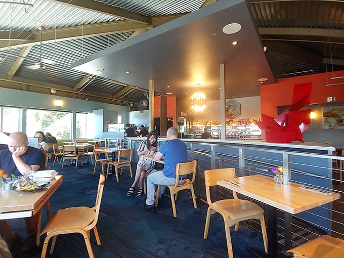 The dining room balances casual comfort with thoughtful design—where conversations flow as easily as the Oregon wines being poured.