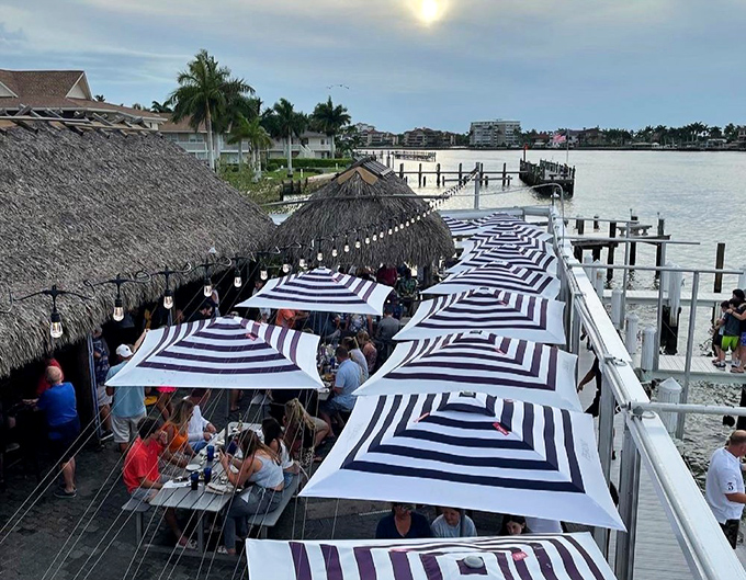 Outdoor dining under striped umbrellas – like being at the world's most delicious beach club without membership fees.