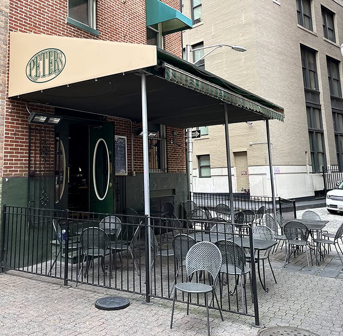 The outdoor seating area offers urban al fresco dining where the soundtrack is pure Baltimore—sirens, laughter, and the occasional heated sports debate.