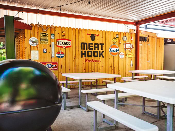 Even the outdoor seating has character – those vintage signs aren't trying, they just are.
