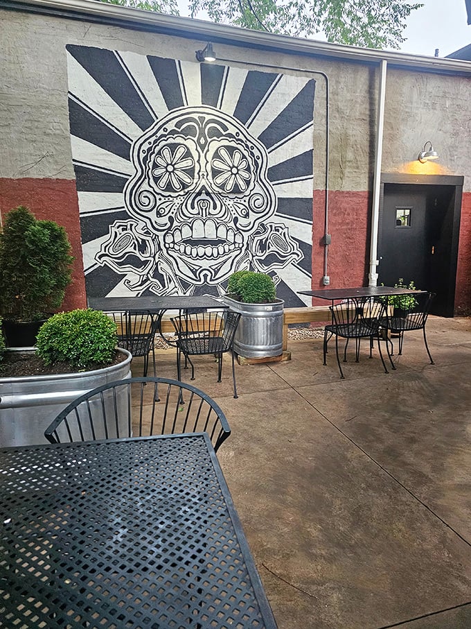 The outdoor patio features a striking sugar skull mural—al fresco dining with artistic edge and just the right amount of Day of the Dead cool.