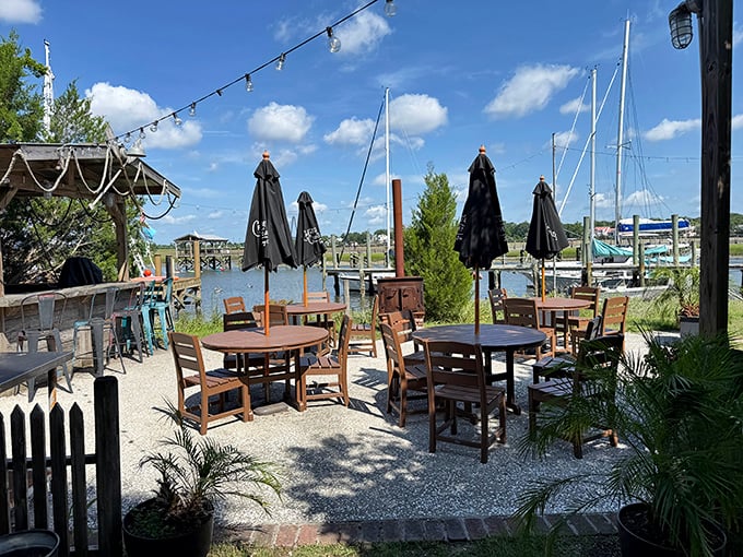 Waterfront dining without pretension – where umbrellas provide shade and the view reminds you exactly why seafood tastes better near the water.