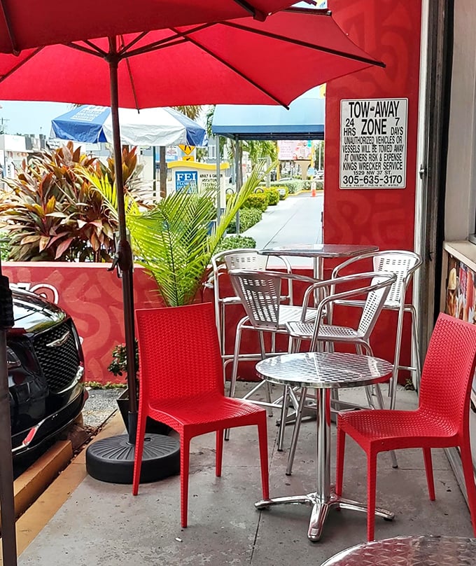 Sidewalk seating where Miami's tropical breezes complement your meal. Red umbrellas provide shade for serious eating.