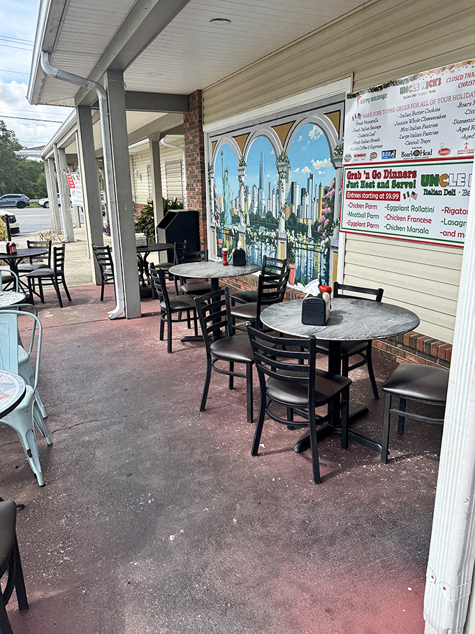 Outdoor seating with an Italian cityscape mural—Florida sunshine meets Mediterranean ambiance for the perfect lunch backdrop.
