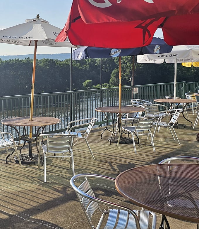 Riverside dining with umbrellas standing guard against too much sunshine—nature's perfect dining companion.