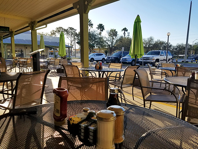Florida dining at its most pleasant—outdoor seating where palm trees sway in the background. Breakfast with a side of vitamin D.