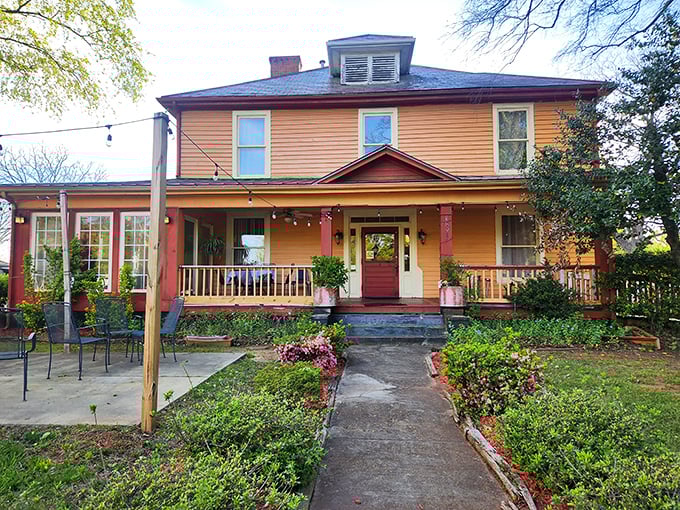 The Victorian exterior with wraparound porch suggests Sunday dinners with family, even if you're dining with strangers.