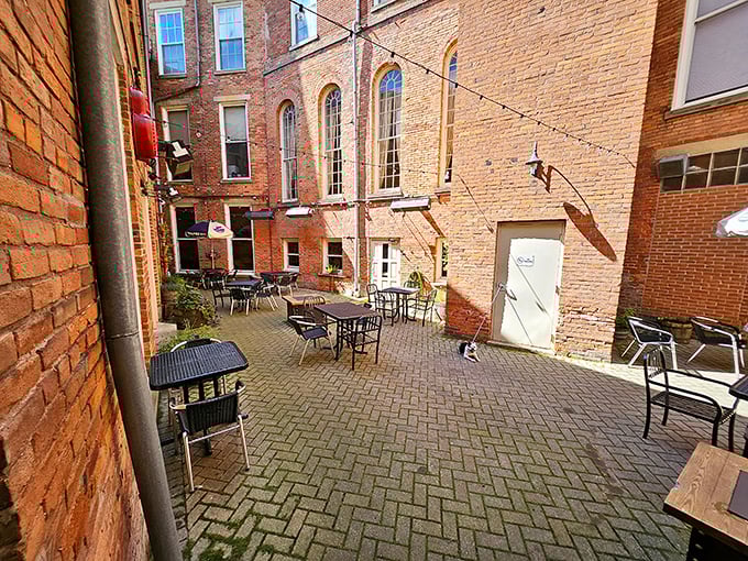 The courtyard where fresh air enhances fresh beer. Even brick walls seem to relax in this outdoor oasis of sips and stories.