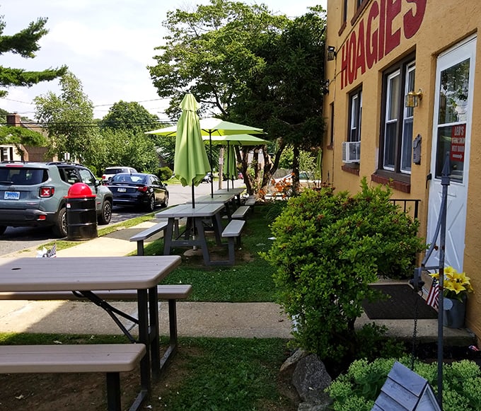 Al fresco dining, Leo's style—picnic tables under green umbrellas where the only thing better than the sandwiches is enjoying them in the fresh air.