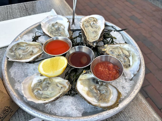 Fresh oysters on ice with three dipping sauces—nature's perfect appetizer and still the most elegant way to taste the ocean without getting wet.