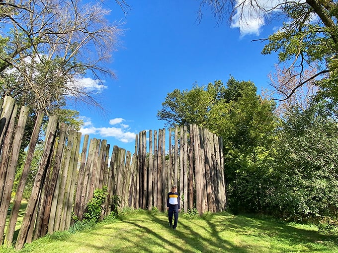 The reconstructed palisade wall offers a tangible connection to the past—ancient security systems before home insurance was a thing.