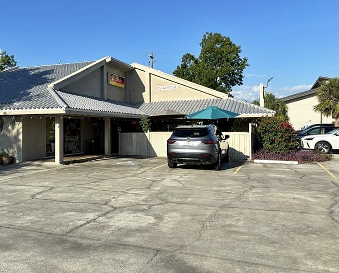 Even the parking lot has European charm. The blue-tiled roof and modest exterior hide the culinary treasures waiting inside this Fort Myers gem.