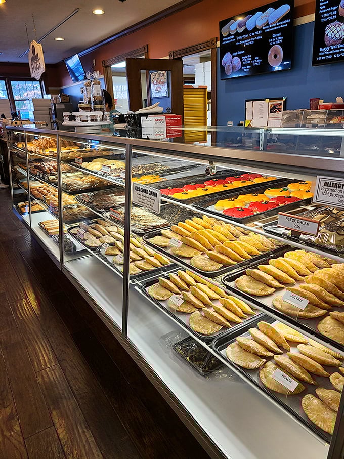 A pastry case that makes willpower crumble faster than those flaky crusts. Those hand pies aren't just desserts—they're edible treasure chests.