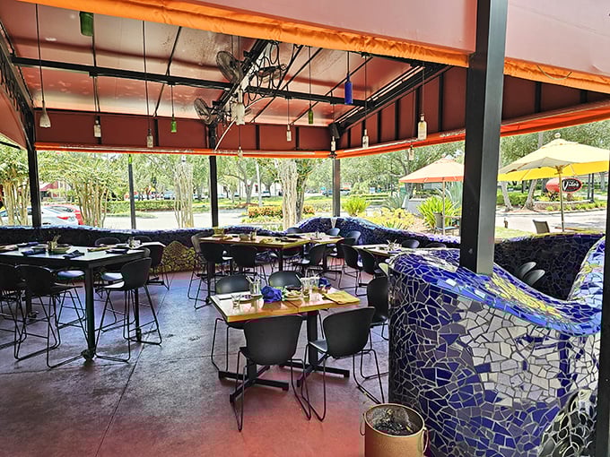 The outdoor patio offers a breath of Florida air with artistic touches—that blue mosaic wall isn't just decoration, it's conversation starter.