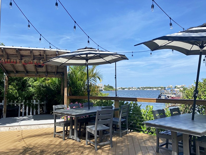 Outdoor dining with string lights and water views—because sometimes the best seasoning is fresh air and the gentle reminder that you're not at work.