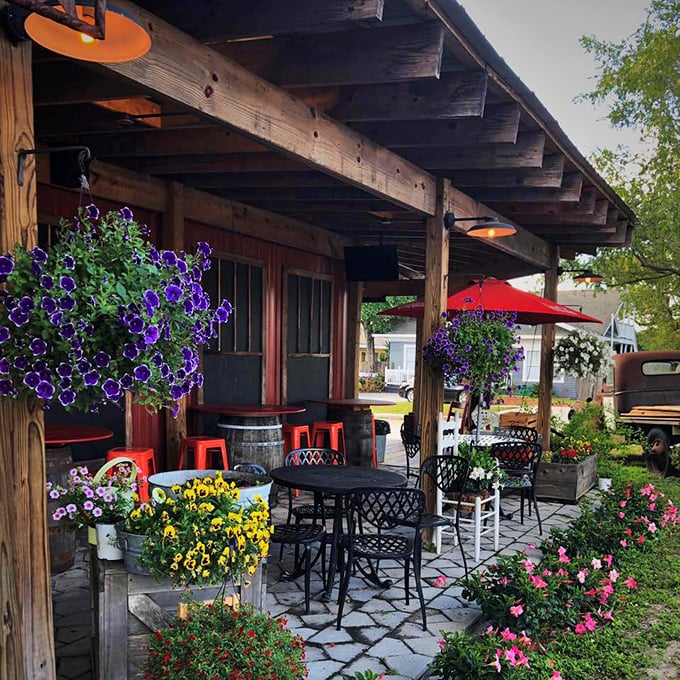 The patio blooms with both flowers and conversation—a perfect Florida setting where coffee cools at exactly the right pace.