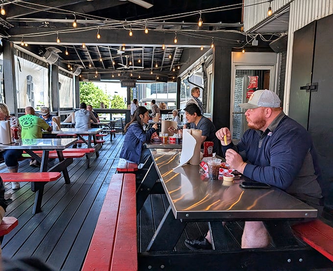 The covered patio isn't just outdoor seating—it's where spice warriors recover in the fresh air, comparing heat-level war stories with neighboring tables.