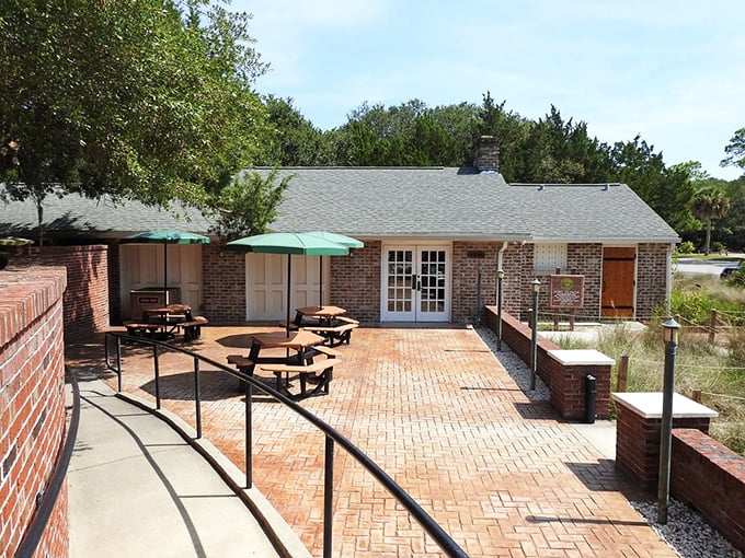 This brick patio has hosted countless picnics and family gatherings. The umbrellas aren't just decorative—they're essential Florida survival gear.