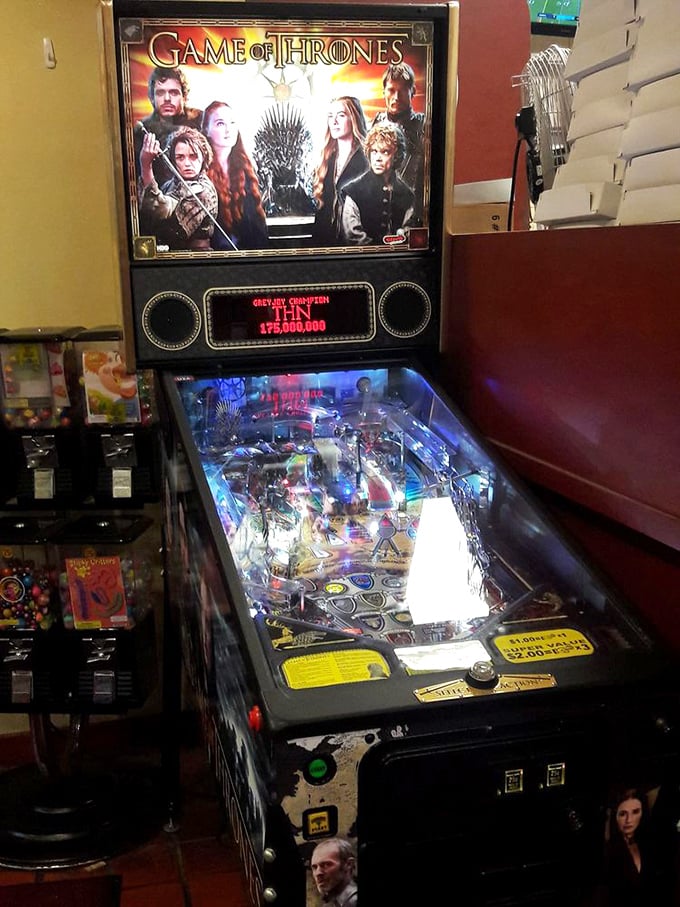 Even the pinball machine knows it's playing second fiddle to the real attraction – though it offers entertainment while waiting for your pizza cut.