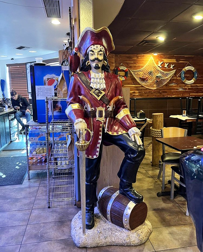The pirate statue stands guard over the dining room—a silent sentinel ensuring your seafood experience is nothing short of legendary.